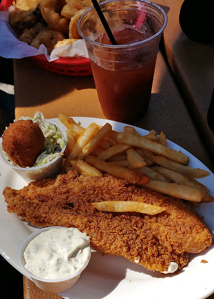 Fish and chips done right – golden fillets that would make any British pub jealous of this Florida interpretation.