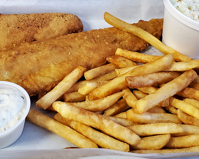 Golden fish fillets and perfectly crisp fries with a side of tartar sauce—the kind of plate that makes you forget you're in landlocked Ohio. 