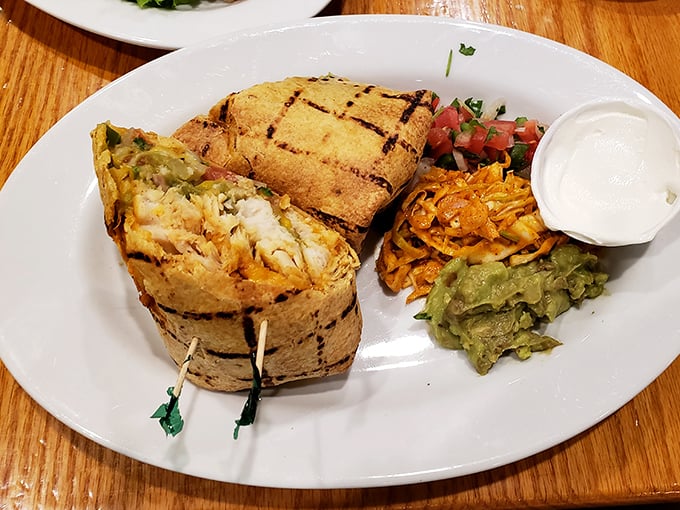 Not your average fish tacos—these grilled beauties are stuffed with enough fresh seafood to make you consider moving closer to the water.