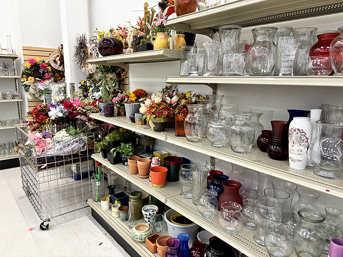 Crystal vases and colorful artificial blooms create a garden of possibilities—permanent flowers that never need watering, just dusting and admiration.