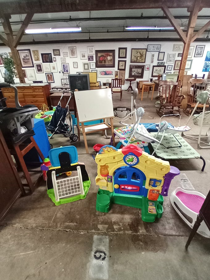 The children's section is a playground of nostalgia where plastic playhouses and wooden easels await new imaginations to bring them to life.