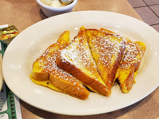 French toast sprinkled with powdered sugar—simple perfection that makes you wonder why anyone bothers with those fancy brunch places and their "deconstructed" nonsense.