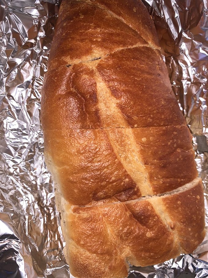 Sourdough bread with a crackling crust and tangy interior – the perfect vehicle for sopping up every last drop of deliciousness.