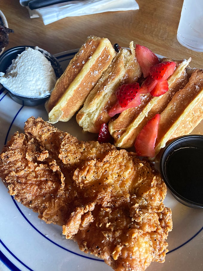 Crispy outside, juicy inside—this chicken and waffle plate is what breakfast dreams about when it goes to sleep at night.