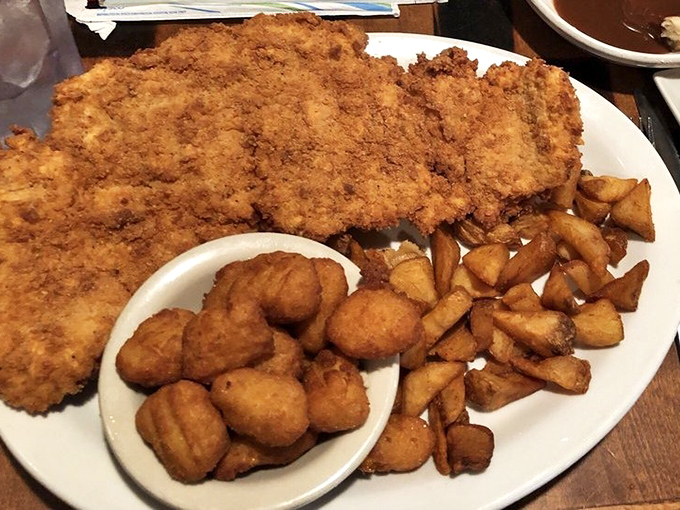 This isn't just fried chicken—it's an exercise in golden-brown perfection that makes you wonder why you'd ever order anything else.