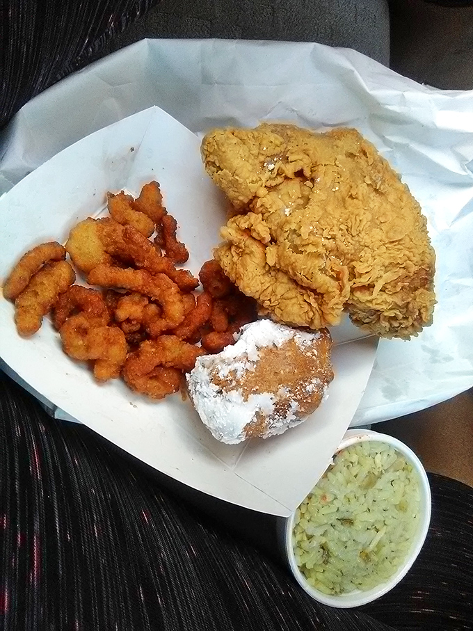 The seafood platter brings together crispy shrimp, golden chicken, and a powdered fritter—proof that Jim Dandy knows more than one way to fry your troubles away.
