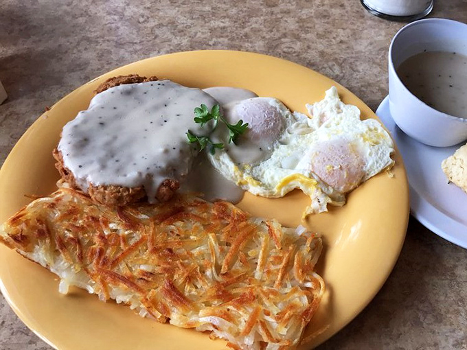 Country-fried steak smothered in gravy alongside perfectly crispy hash browns and eggs. The breakfast of champions who aren't counting calories.
