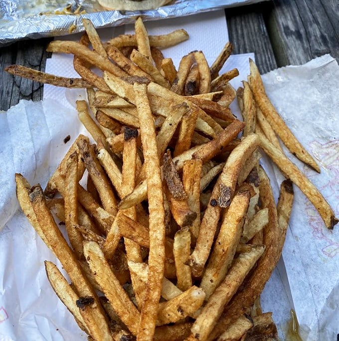 These aren't just fries—they're crispy potato ambassadors that have earned their own fan club and possibly deserve their own zip code.