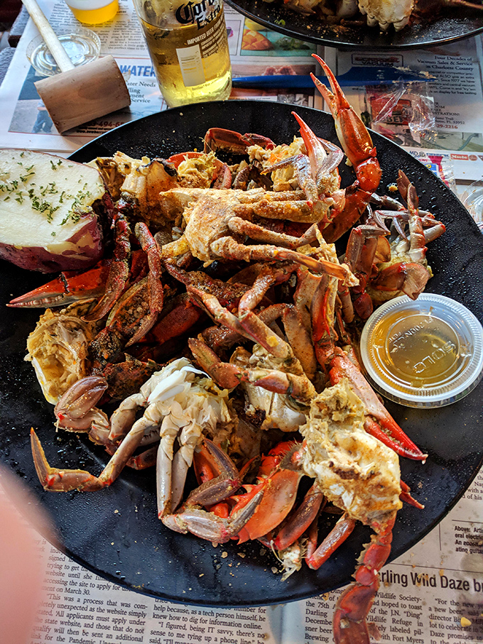 Garlic crab clusters that look like they've been blessed by the Old Bay gods. The potato on the side isn't decoration—it's there to soak up that precious, finger-licking sauce.