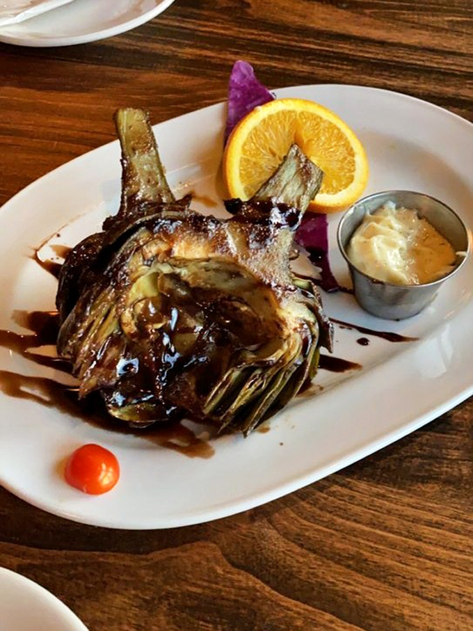 Grilled artichoke with balsamic glaze—proof that vegetables can be both sophisticated and indulgent. California's agricultural bounty at its charred, tender best.