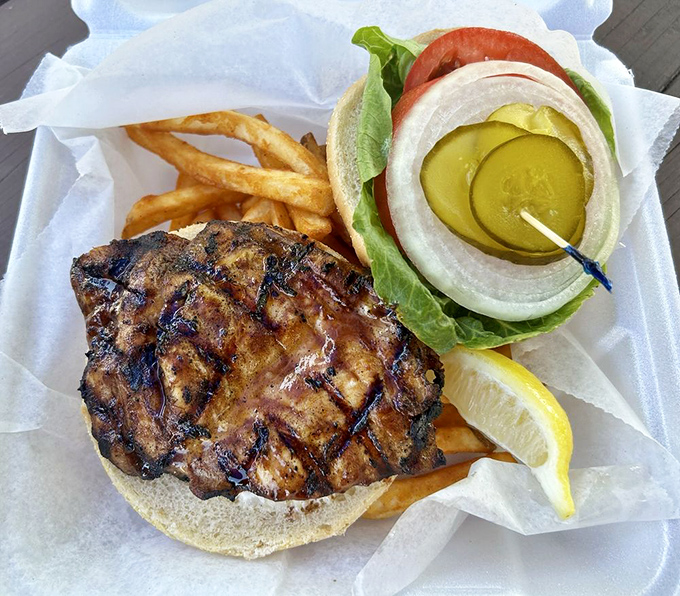 This grilled grouper sandwich doesn't need fancy accessories—just fresh fish, simple toppings, and a squeeze of sunshine-yellow lemon.