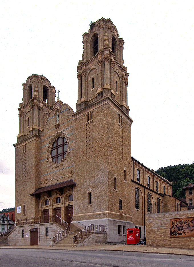 The impressive façade of St. Nicholas Croatian Catholic Church commands attention with its ornate twin towers and distinctive Romanesque-Byzantine architecture.