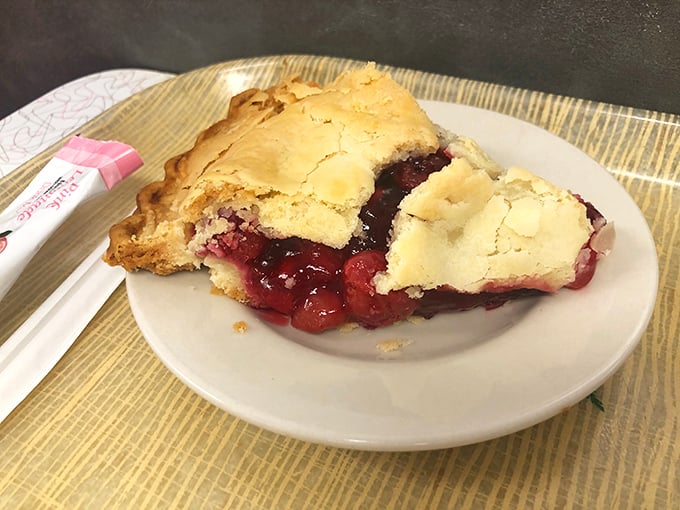 Pie that would make your grandmother simultaneously proud and jealous. That cherry filling isn't just fruit—it's summer captured in a perfect golden crust.
