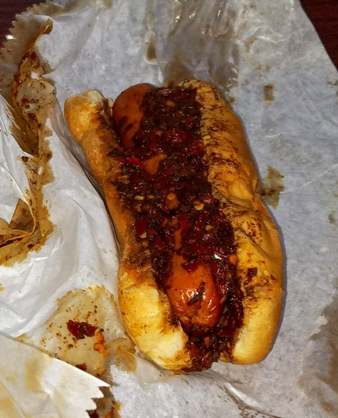 Hot dogs get the royal treatment here, blanketed in that famous chili sauce. Not all heroes wear capes – some wear buns.