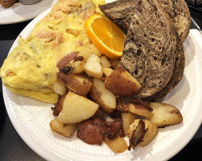 Breakfast alchemy at its finest. Golden potatoes, perfectly scrambled eggs, and toast that knows its supporting role—a plate that says "good morning" like it means it.