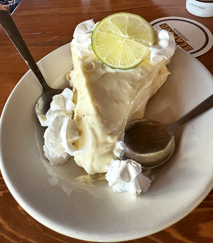 Key lime pie so authentic it should come with its own Florida citizenship papers—tart, sweet, and unapologetically creamy.
