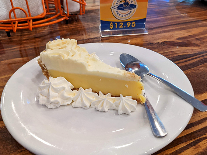 The legendary key lime pie in all its glory—the perfect balance of tart and sweet with a dollop of fresh whipped cream. Florida on a plate.