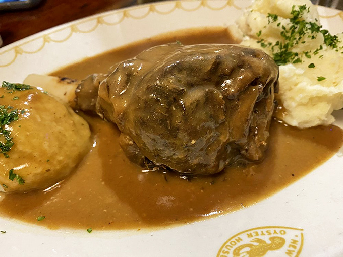 This lamb shank isn't just falling off the bone—it's practically begging to jump onto your fork. Swimming in rich gravy alongside a perfect potato dumpling.