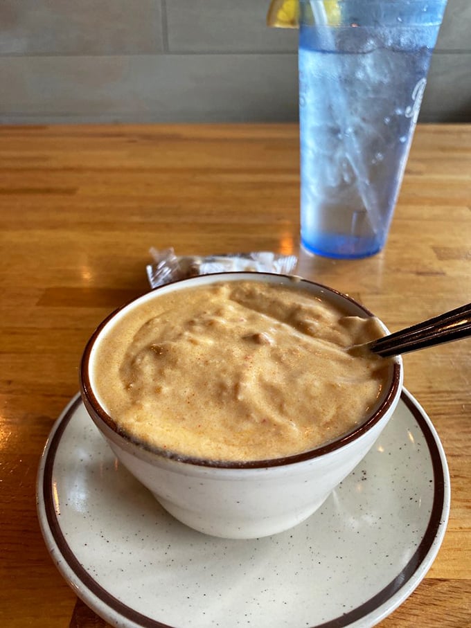 The legendary lobster bisque—a velvety coral-hued masterpiece that's worth crossing state lines for. One spoonful and you'll understand why it inspires devotion.
