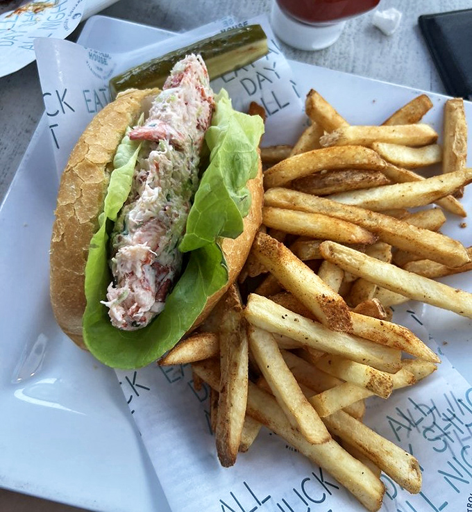 This lobster roll doesn't skimp on the good stuff – chunky lobster meat barely contained by its toasted vessel, with fries standing by for backup satisfaction.