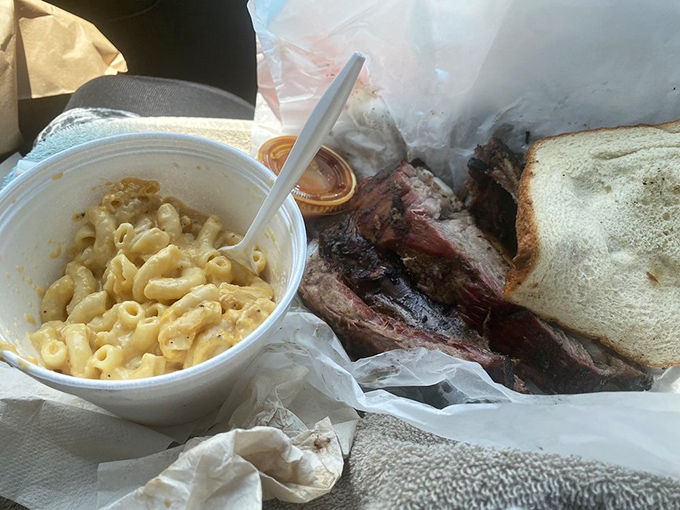 Mac and cheese meets barbecue in a styrofoam container that holds more comfort than most fancy restaurants' china.