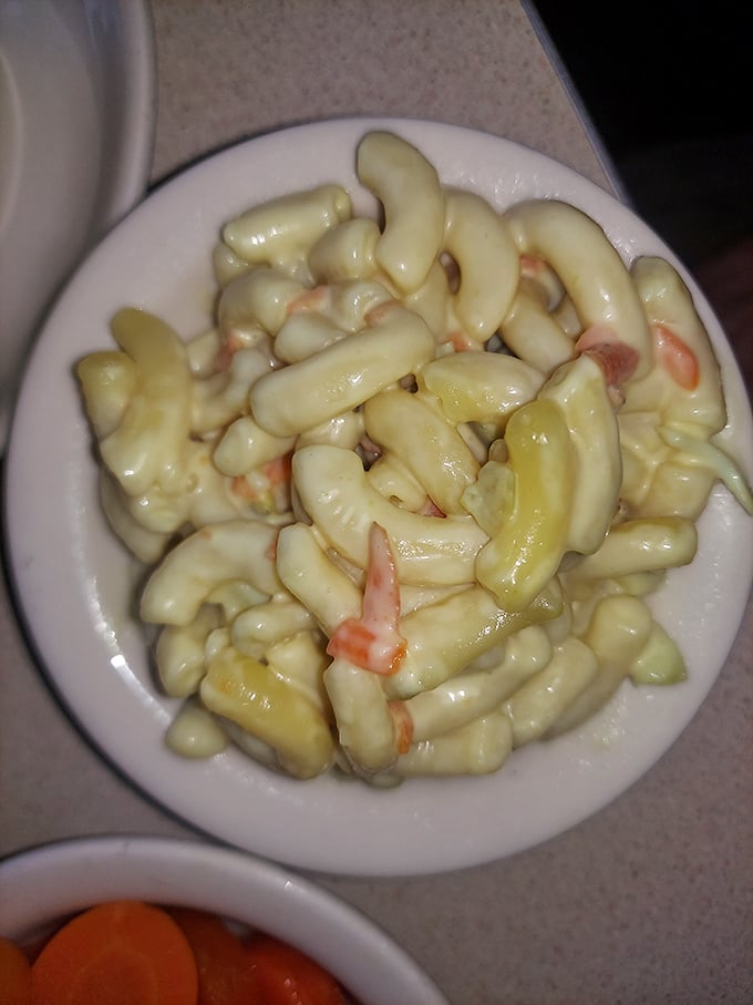 Macaroni salad that your grandmother would approve of. Simple, creamy, and oddly comforting—the kind of side dish that completes a meal without stealing the spotlight.