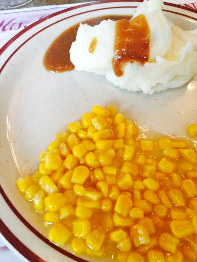 Mashed potatoes with gravy alongside buttery corn – the side dish dynamic duo that's never going out of style.