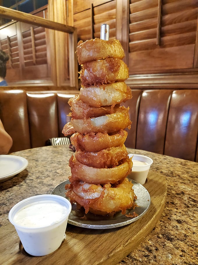 The onion ring tower – architecture you can eat! Each golden ring stacked like a delicious Jenga game waiting to be dismantled.
