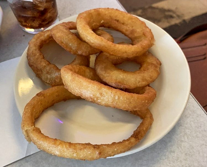 These onion rings aren't just side dishes—they're golden halos of happiness. Crispy, substantial, and worthy of their own fan club.