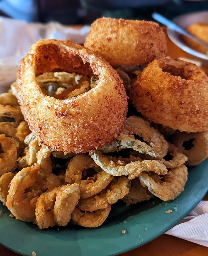 These aren't just onion rings—they're golden halos of happiness. Crispy, substantial, and demanding to be eaten while still hot.