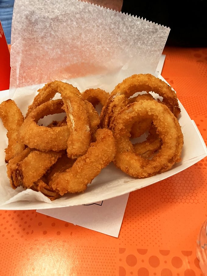 Golden halos of fried perfection. These onion rings aren't just crispy; they're what angels must snack on during celestial coffee breaks.