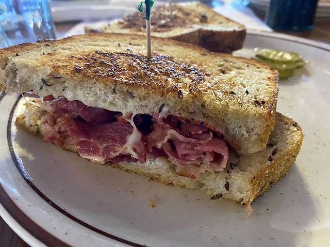 The pastrami sandwich: where thinly sliced heaven meets toasted bread in a relationship so perfect, it deserves its own love song on the jukebox.