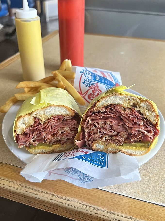 This pastrami sandwich isn't messing around—layer upon glorious layer of thinly-sliced meat that New York delis would respectfully nod at.