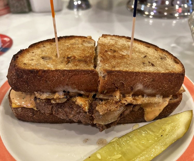 Behold the patty melt in its melty, caramelized glory. This sandwich doesn't just satisfy hunger—it creates memories between two perfectly grilled slices.