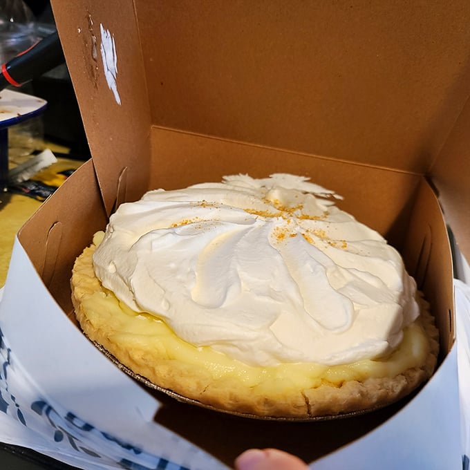 This peanut butter pie doesn't just satisfy cravings—it creates lifelong devotion. That cloud of whipped cream is basically a pillow for your taste buds.