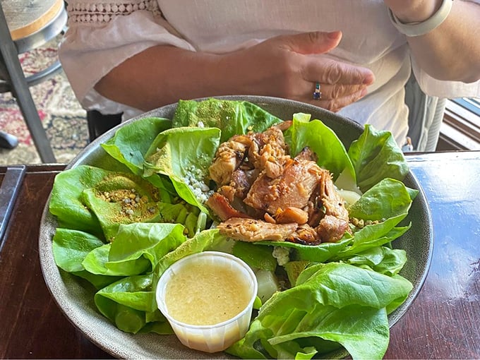 A salad that actually excites! Fresh greens playing host to what appears to be perfectly seasoned protein—proof that healthy choices needn't be punishment.