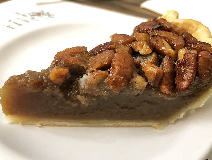 Pecan pie so rich and decadent it should come with its own inheritance tax—a sweet-tooth symphony of caramelized filling and crunchy nuts.