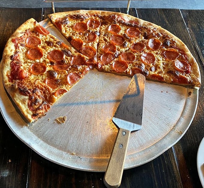 This pepperoni pizza doesn't just have toppings—it has a constellation of perfectly crisped pepperoni discs creating a meaty galaxy of flavor.
