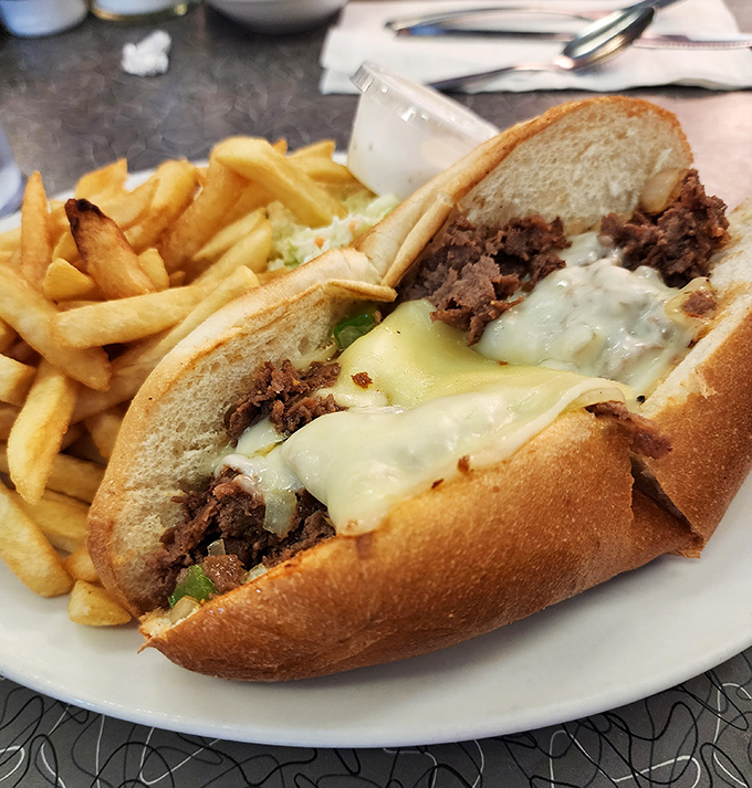 Philly meets Florida in this cheese-draped masterpiece. The bread cradles the filling like it's protecting something precious—because it is.