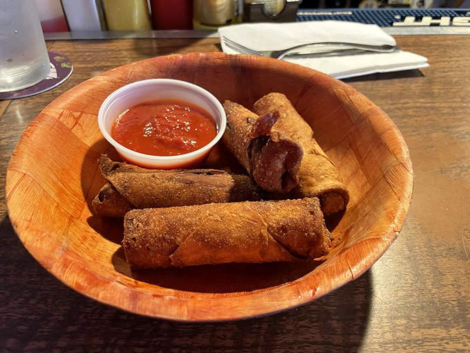 These aren't your freezer aisle pizza rolls. They're crispy, golden time machines to childhood—but with grown-up flavor that demands a cold beer.