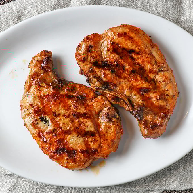 Pork chops so perfectly grilled they make you wonder why you ever bothered with fancier cuts of meat. Simple food done right is culinary poetry.