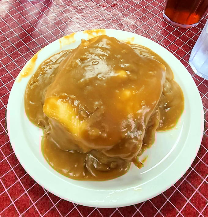 Behold the mighty Hot Manhattan—tender meat and bread islands swimming in a gravy ocean that would make Neptune himself jealous.