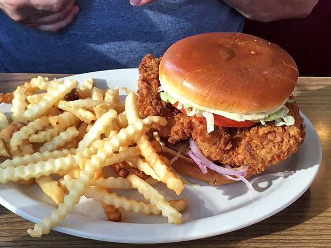 The legendary pork tenderloin sandwich – where the meat extends so far beyond the bun it needs its own zip code.