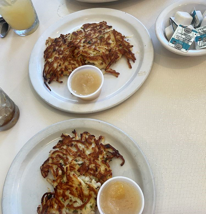 These potato pancakes aren't just crispy—they've achieved the golden-brown perfection that lesser hash browns only dream about. Applesauce never had it so good.