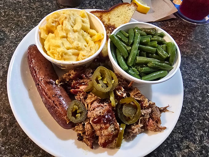 Pulled pork with jalapeños standing guard—a Florida twist on a Southern classic. The mac and cheese returns for an encore performance.