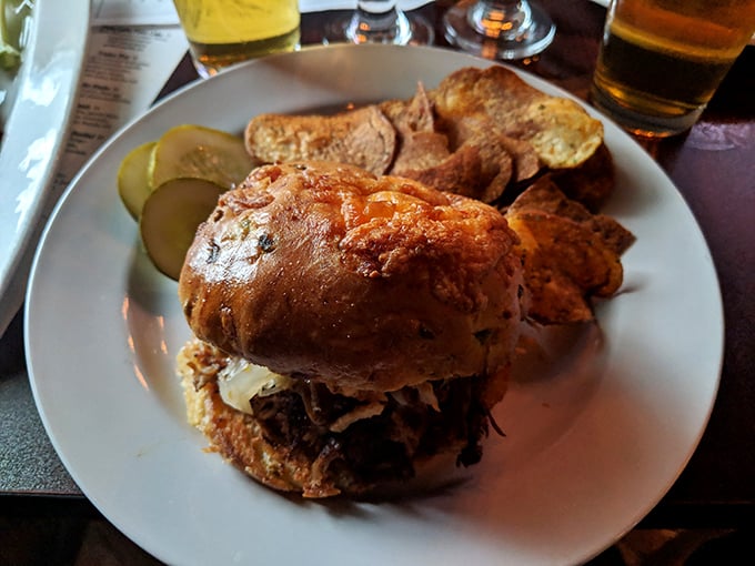 This pulled pork sandwich isn't messing around—serious comfort food with house-made chips that'll make you question store-bought forever.