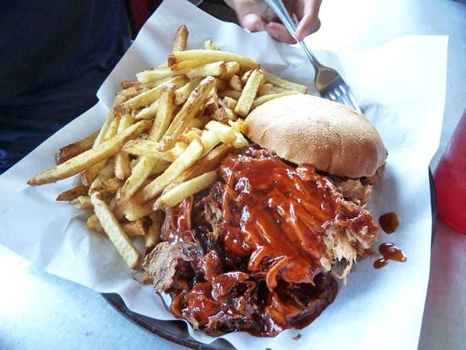This pulled pork sandwich doesn't just satisfy hunger—it creates memories. The golden fries are merely supporting actors in this meaty blockbuster.
