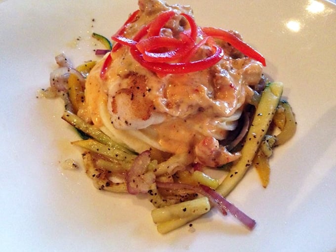 This red snapper nestled among colorful vegetables isn't just dinner—it's edible artwork that tastes even better than it looks.
