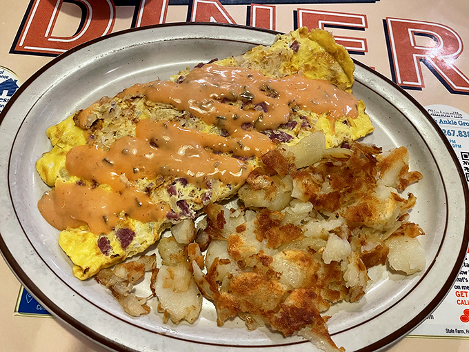 The legendary Reuben omelet with its crown of Thousand Island dressing. Like a sandwich and breakfast had a beautiful baby.