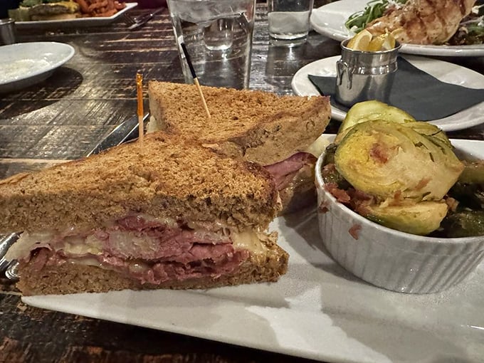 The Reuben sandwich doesn't mess around, packed with tender corned beef and paired with Brussels sprouts that might convert even the most determined veggie-avoider.